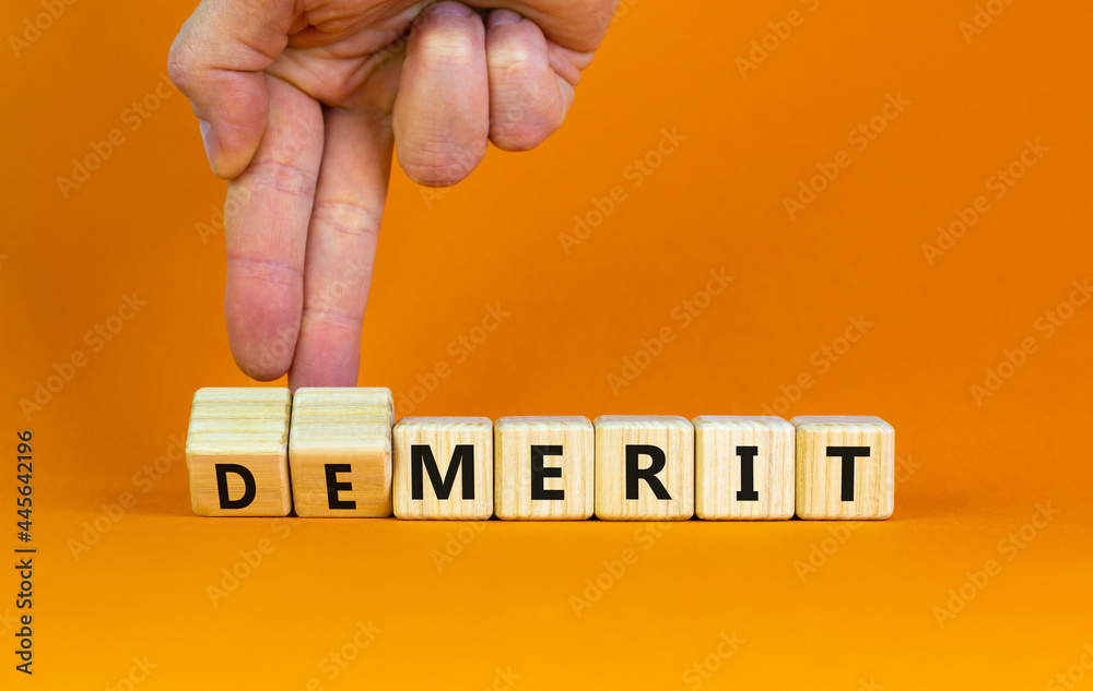 Demerit or merit symbol. Businessman turns wooden cubes and changes ...