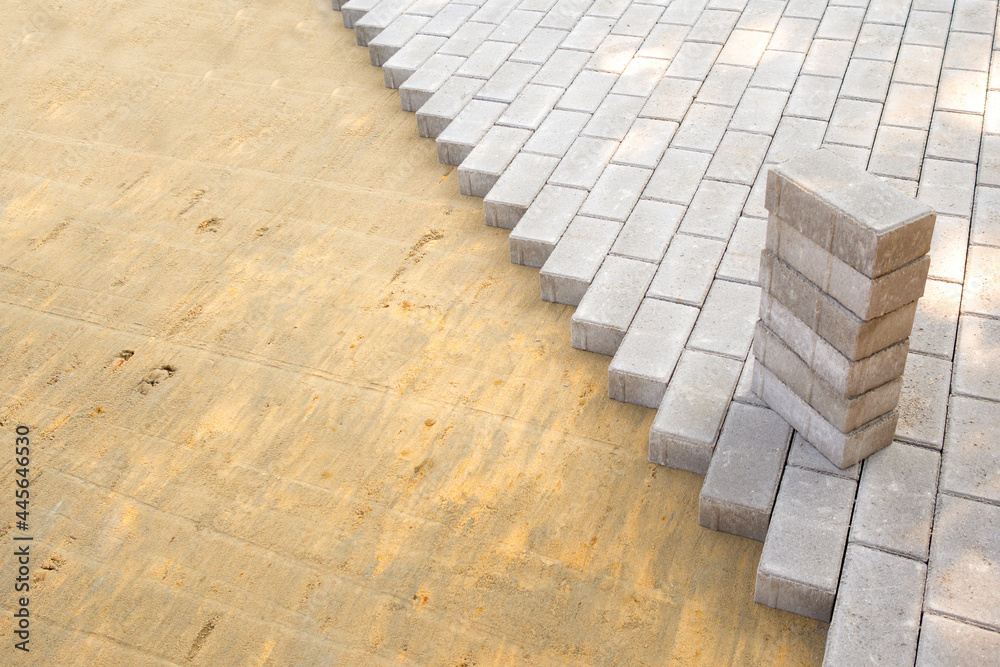 Top view of the edge of surface with laid gray paving slabs. Surface ...