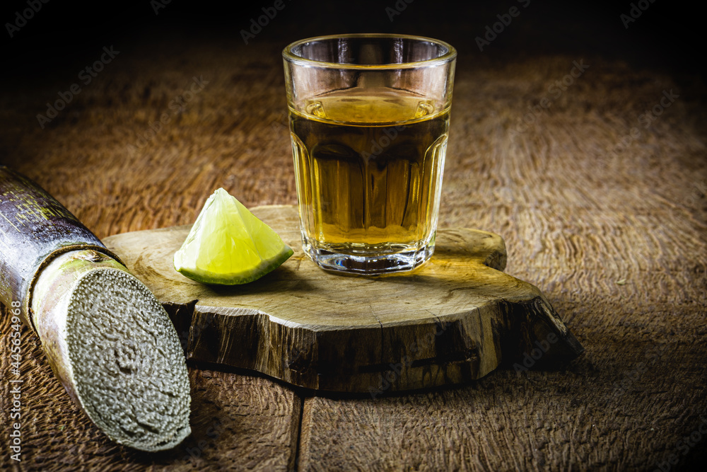 glass of cachaça, a Brazilian drink distilled from sugar cane, served ...