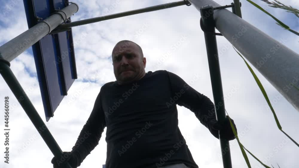 Active Guy Doing Dip Bar Workout With Self-made Bars On Road Signs ...