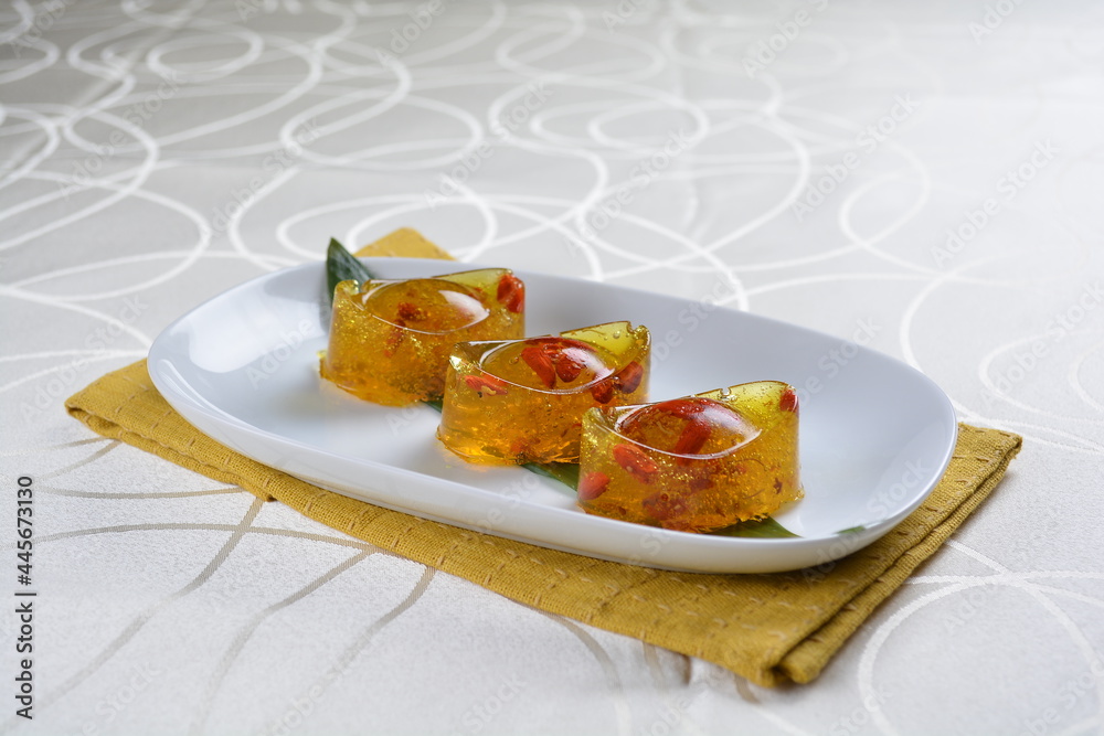 chinese dessert cold jelly with herb gui Hua flower yellow pudding in ...