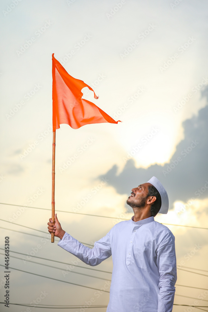 Young indian man (pilgrim) in traditional wear and waving religious ...
