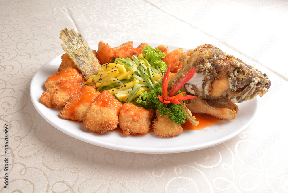 deep fried whole grouper fish seafood with sweet and sour sauce & mango ...