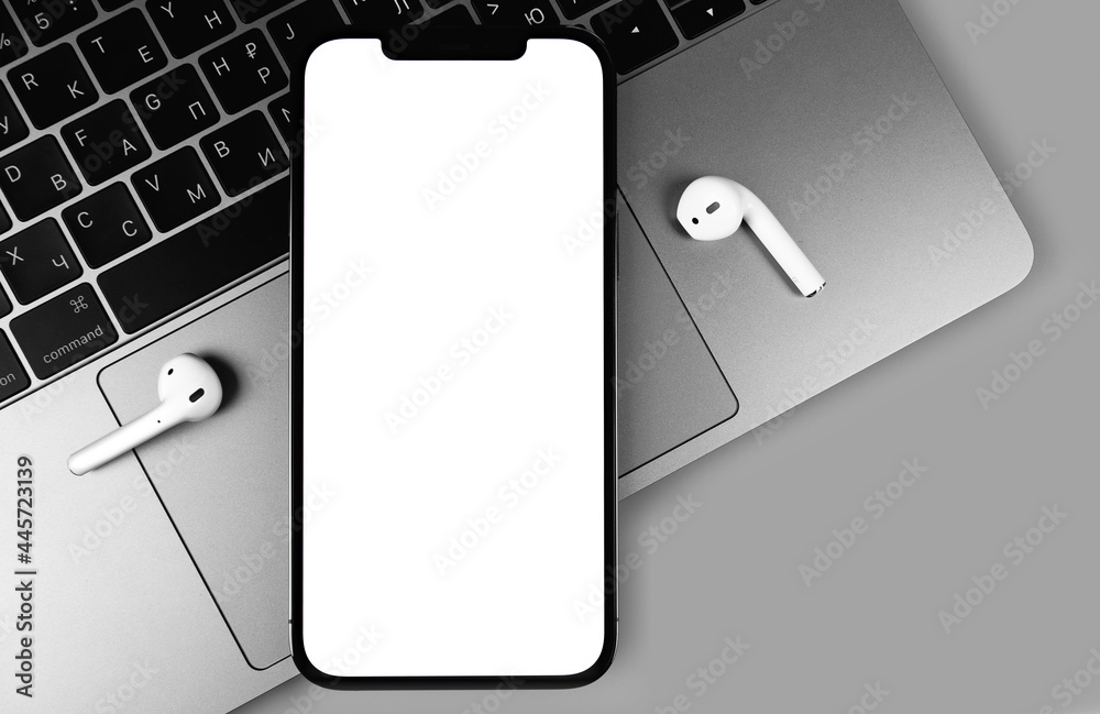 mockup smartphone iPhone 12 Pro Max with blank white screen and Macbook ...