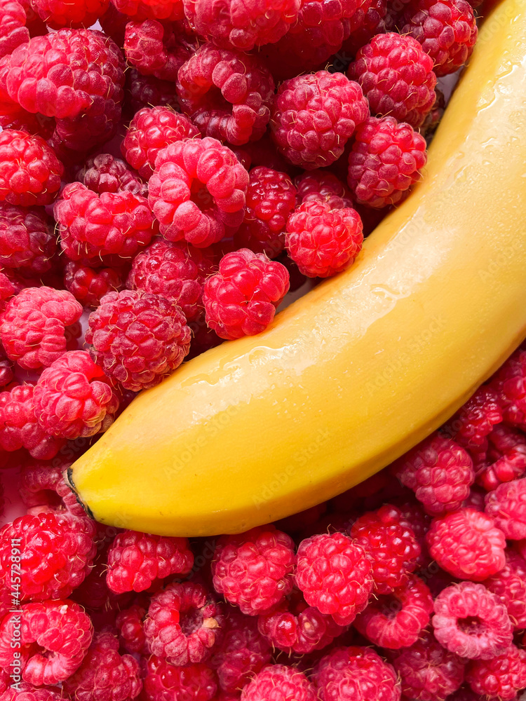 Banana in raspberries, the taste of banana with raspberries, berry ...