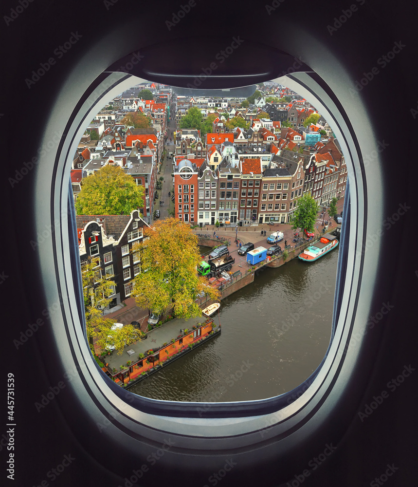 Looking through the airliner window out. Beautiful scenic Amsterdam ...