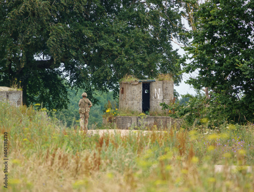 British army soldier on duty standing guard with SA80 rifle in hand ...