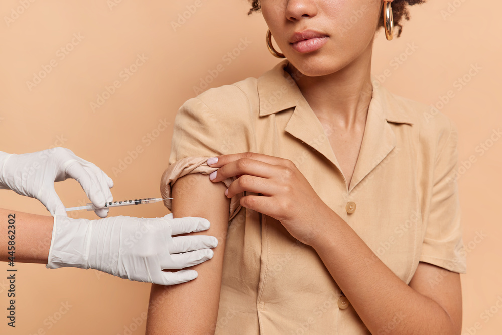 Unknown person with dark skin makes covid 19 vaccination gets injection ...
