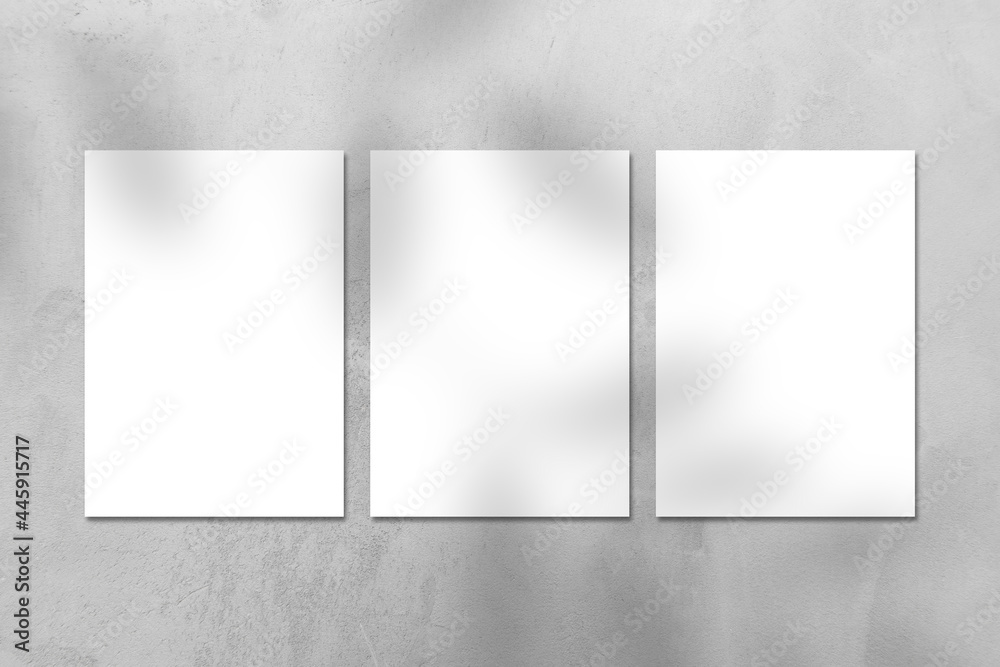 Three empty white vertical A4 rectangle poster or business card mockups ...