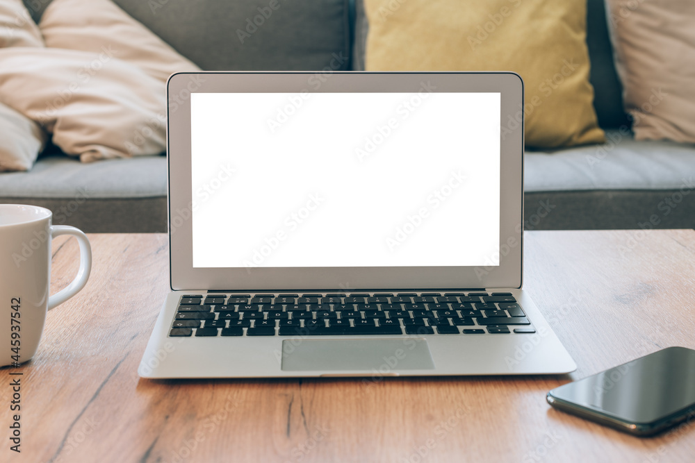 Laptop computer blank empty mock up screen in home office interior ...