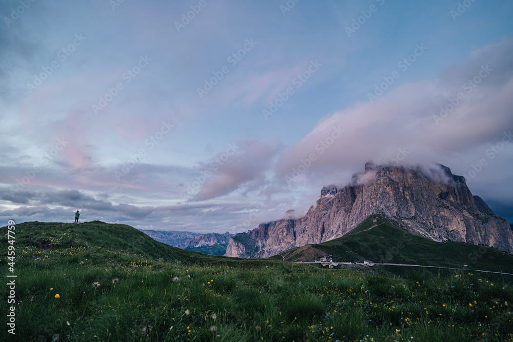 The Sella Group and Sella Towers in the motion blurred clouds. Evening ...