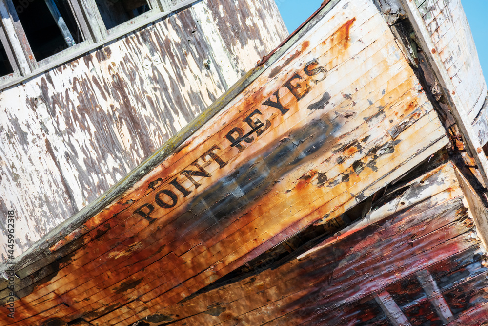 Point Reyes sign on weathered bow of shipwreck, an abandoned boat on a ...