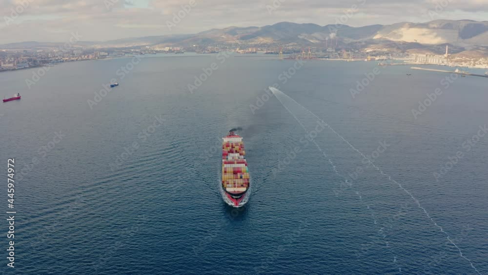 Aerial top view drone flies over to large cargo ship. Freight vessel ...