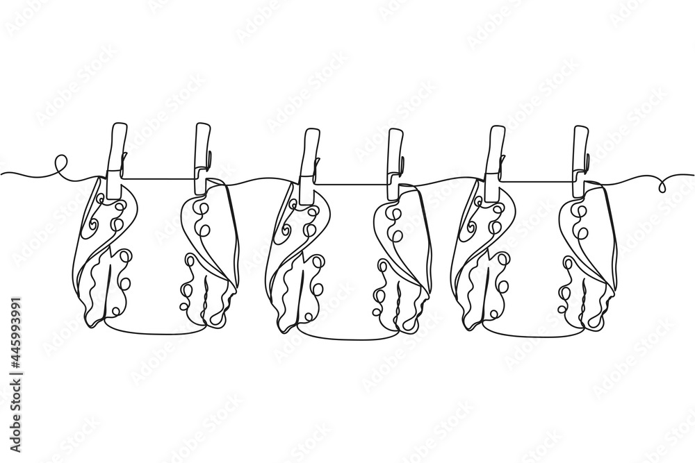 Continuous one line of reusable cloth baby diapers drying on a ...