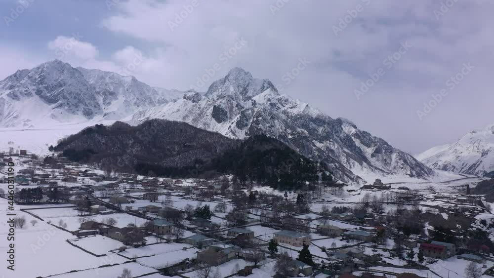 Scenic aerial view of winter landscape with small townlet of Sioni at ...