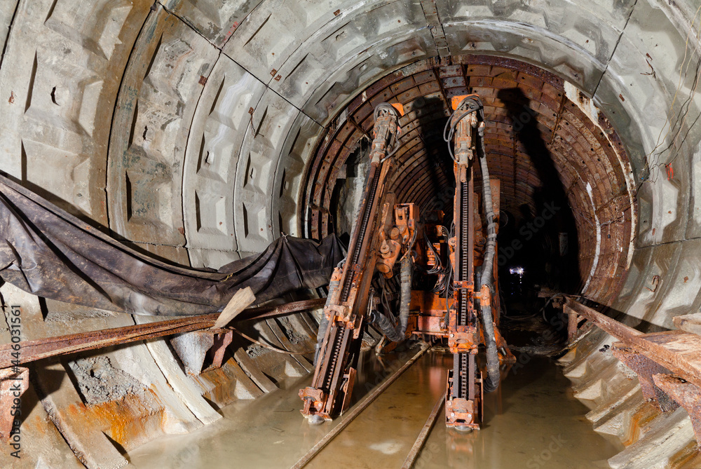 Subway tunnel construction. Deep metro line construction. Old mine for ...