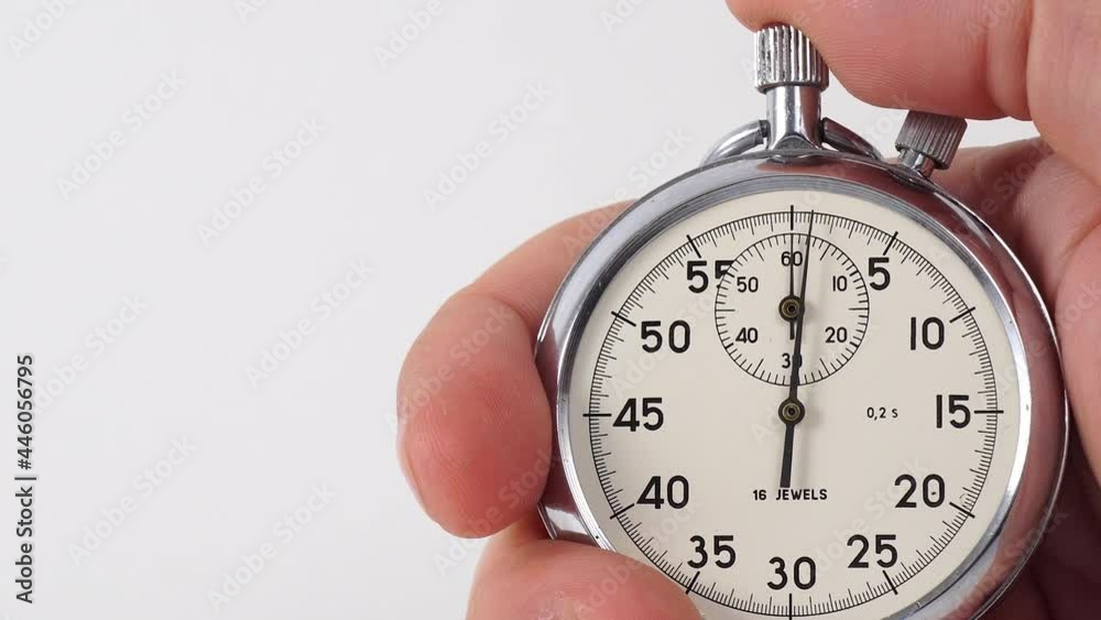 Mechanical Stopwatch in man's hand. Male hand holding stopwatch on ...