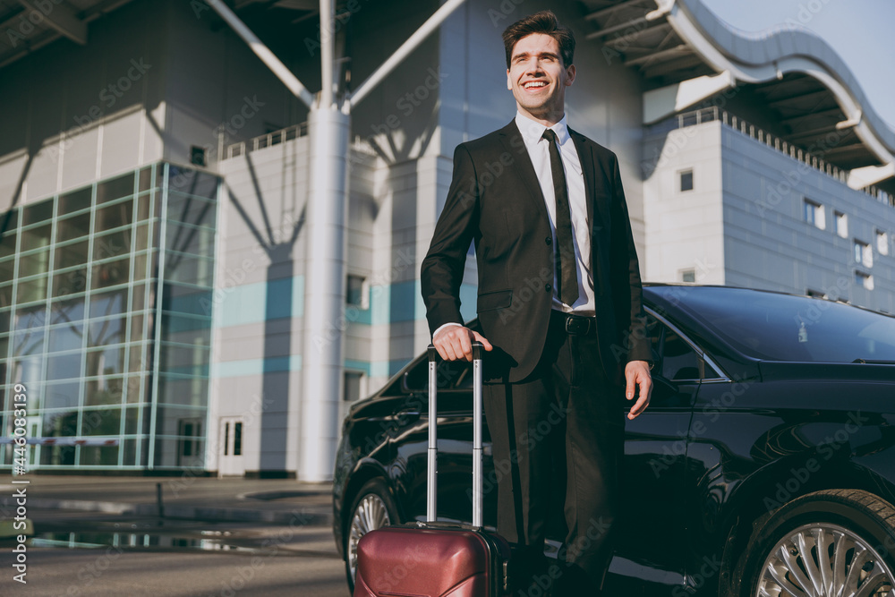 Bottom view minded young traveler businessman young man in black dinner ...