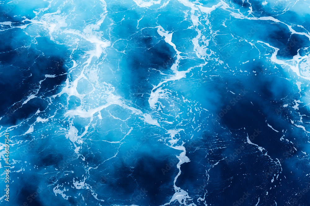 Waves and blue water as a background. View at the ocean surface ...