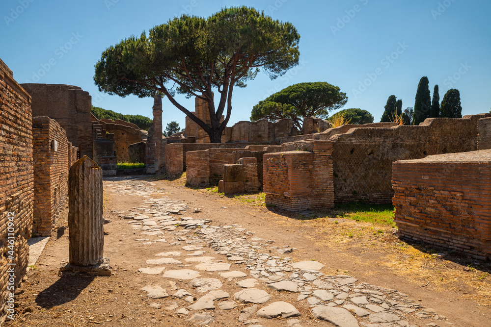 Rome Ostia site, ancient Roman ruins of a street with brick buildings ...