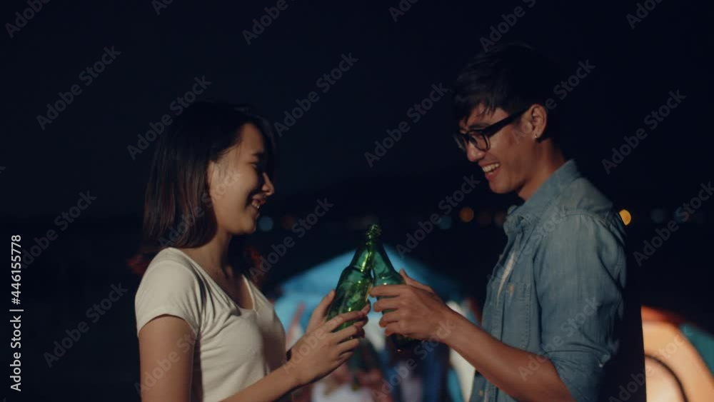 Couple Asia teenagers drinking have fun salute toast of bottle beer ...