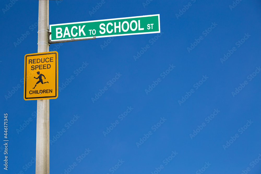Street signs on a pole with a road name Back to School. The concept of ...