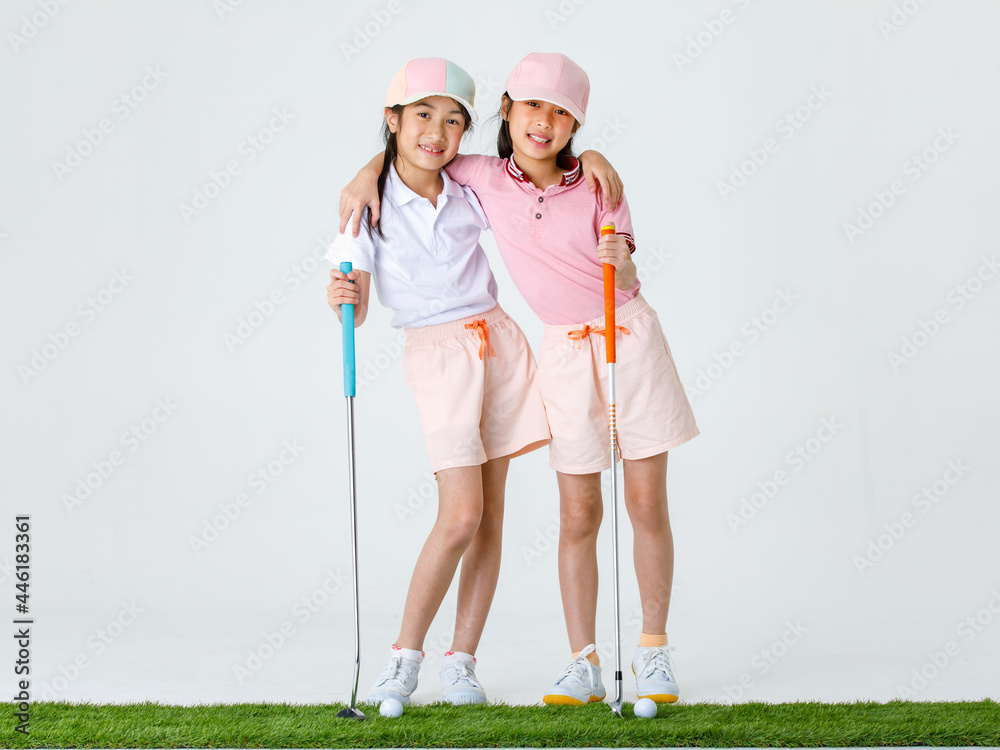 Portrait isolated studio shot of two Asian little professional girl ...