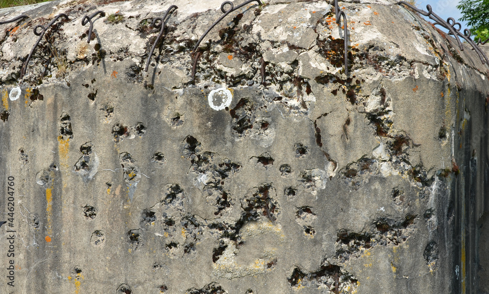 shot down concrete fortification with a machine gun. bullet holes ...
