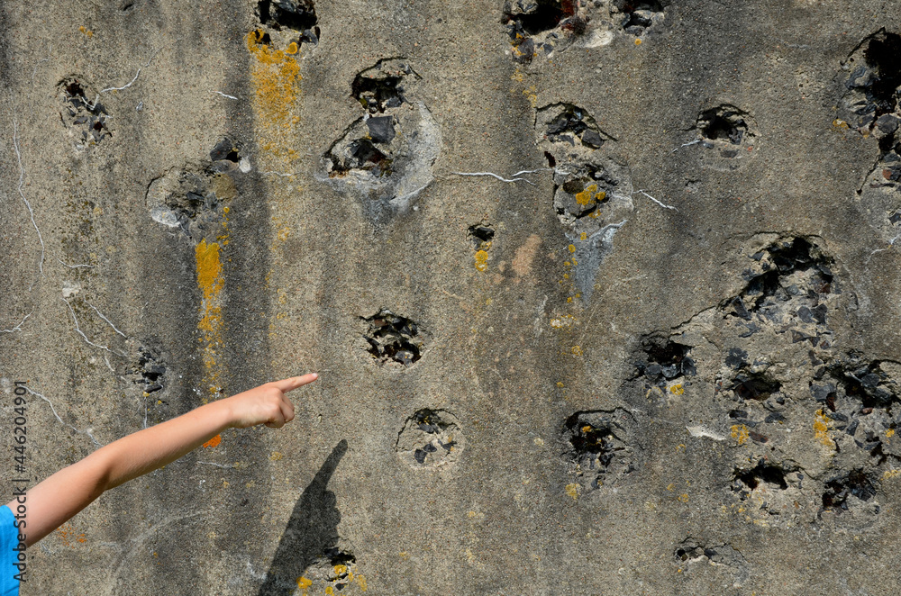 shot down concrete fortification with a machine gun. bullet holes ...