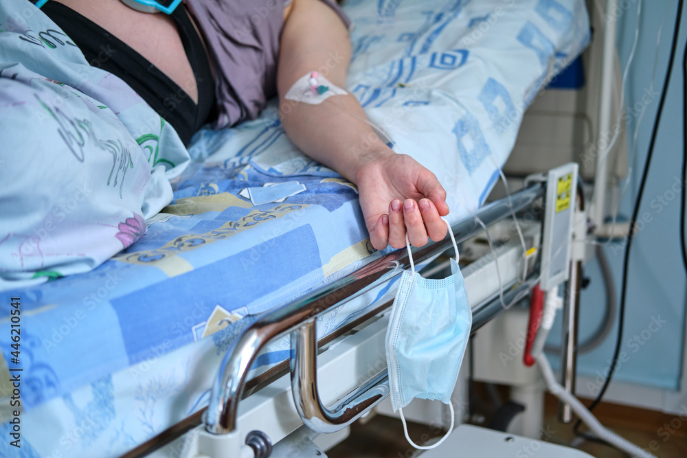 A pregnant woman gives birth in a hospital with a drip and a CTG ...