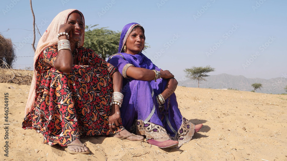 Happy Indian women in traditional clothes sitting outdoor Stock Photo ...