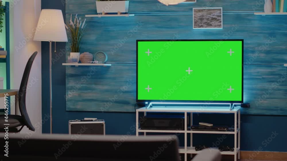 Green screen on monitor in empty living room connected to television at ...