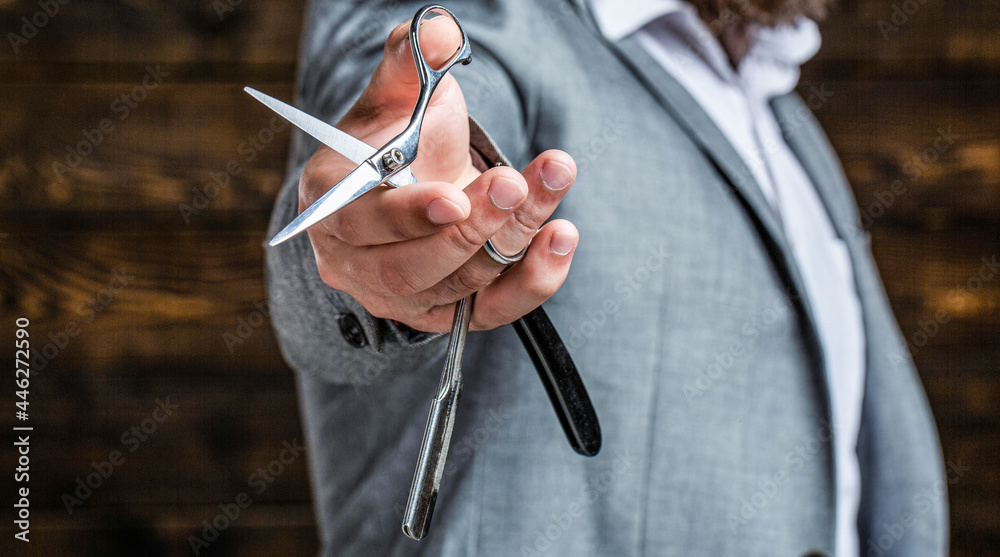 Vintage barbershop. Brutal guy, scissors, straight razor. Client ...
