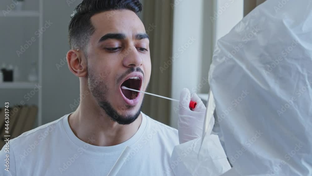 Close-up spanish man arabic male patient opens mouth donates saliva ...