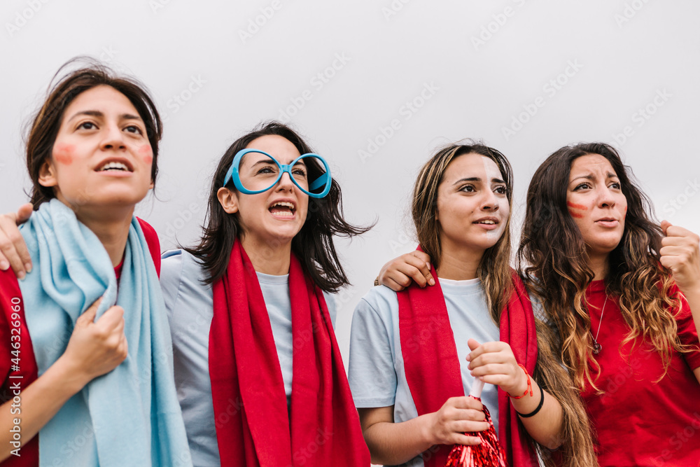 Multi generational women watching sport event at stadium - Group of ...
