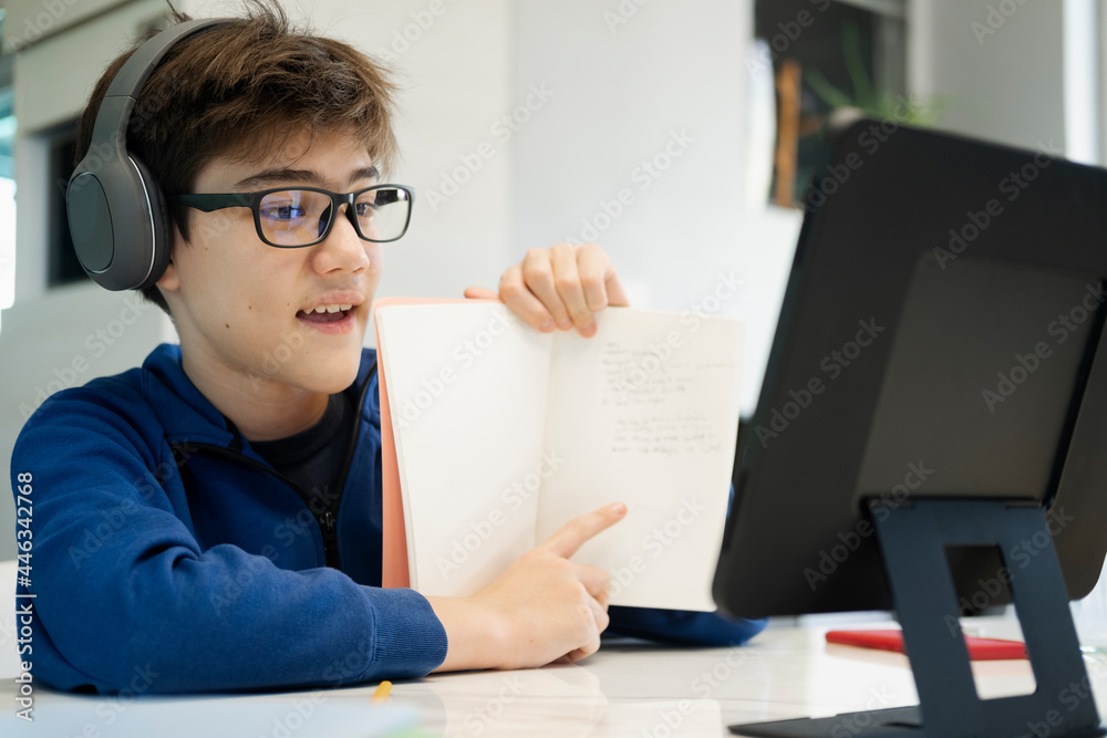 Young collage student using computer and mobile device studying Stock ...