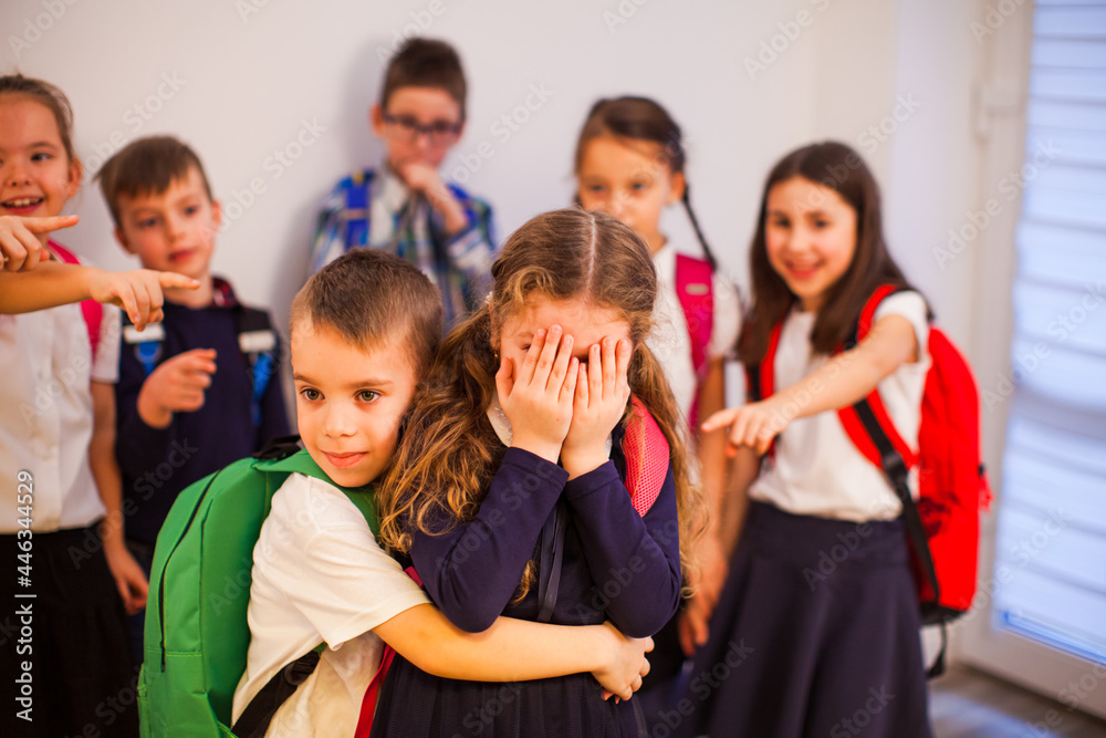 The brave little schoolboy protects a schoolgirl while bullying Stock ...