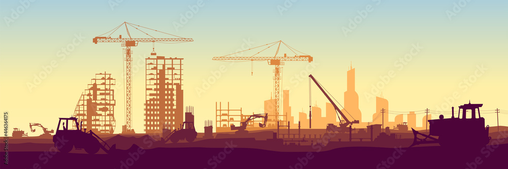 Construction site with a tower crane. Excavators are digging the ground ...