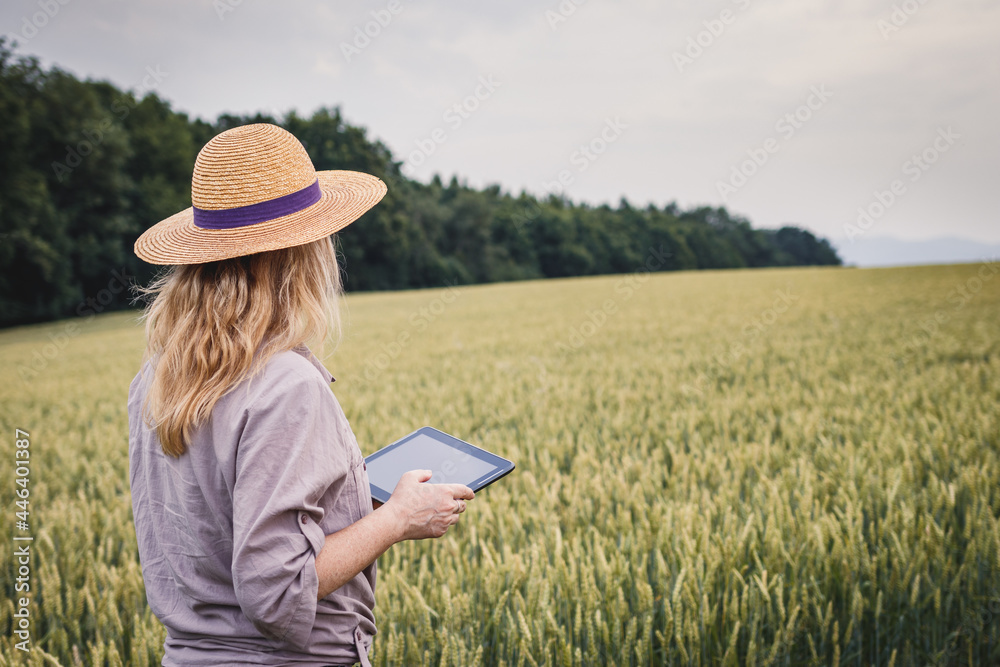 Farmer using modern technology for smart farming. Female agronomist ...
