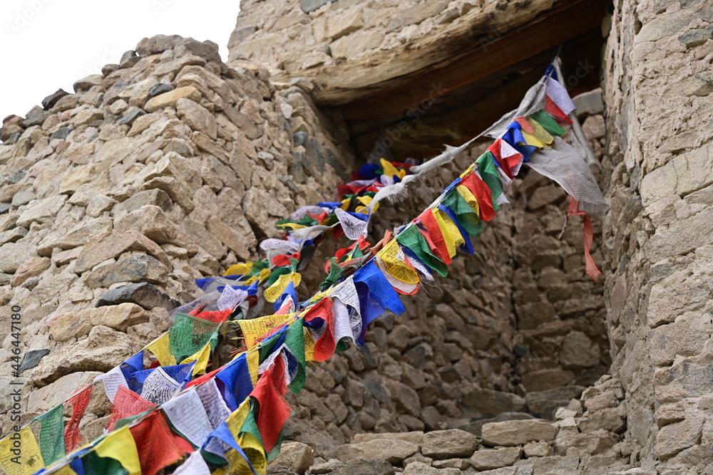 5 color prayer flags with prayer scripts are written on each flag. They ...