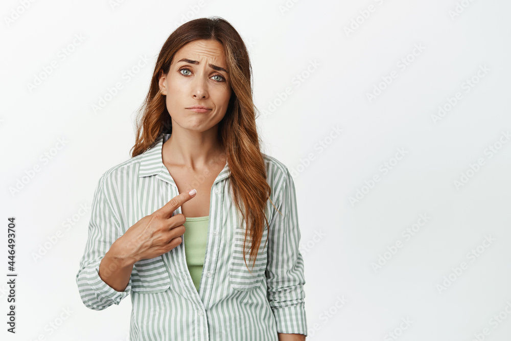 So sorry. Portrait of brunette woman express pity, pointing finger at ...