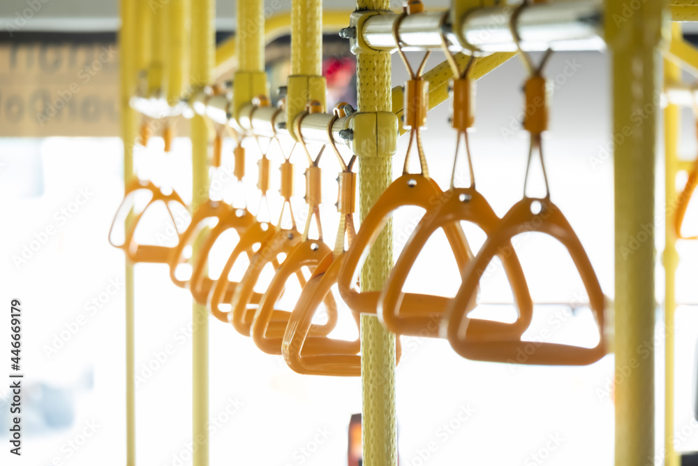 Yellow triangle handrails on buses. Stock Photo | Adobe Stock
