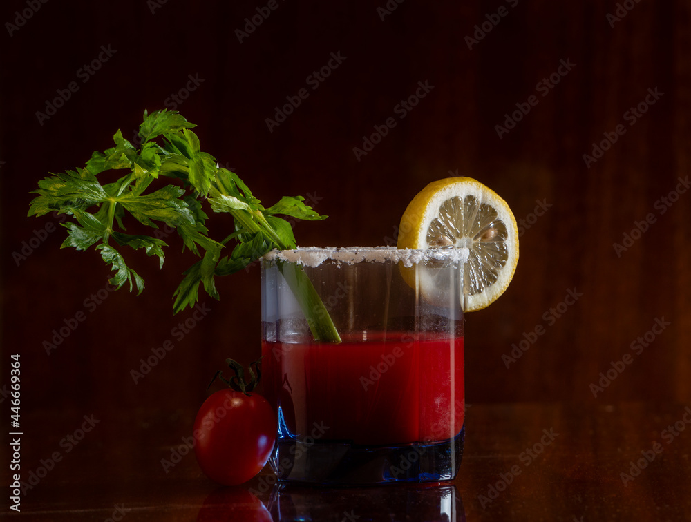 Bloody Mary cocktail in the glass. An alcoholic drink with a slice of ...
