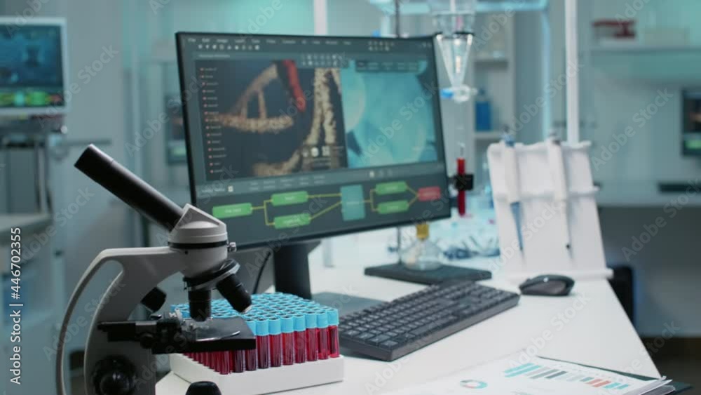 Empty laboratory with dna animation on computer and chemical equipment ...