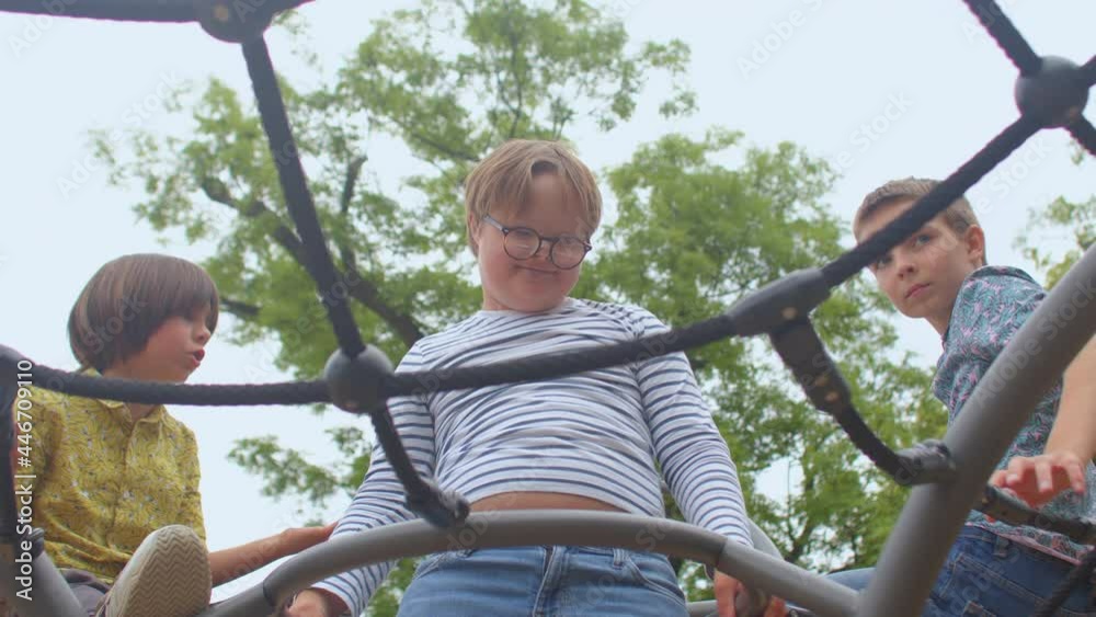 The boys wave to the camera affably. Children with Down syndrome are ...