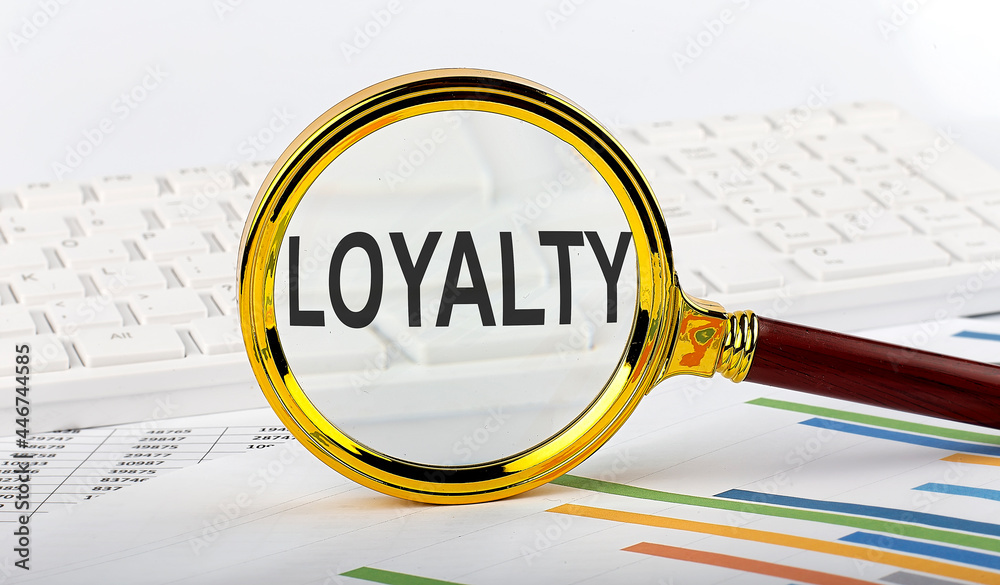 Magnifying glass with the word LOYALTY on the chart background Stock Photo | Adobe Stock