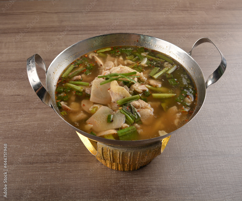 thai clear tom yum spicy chilli hot soup with seafood, meat and ...