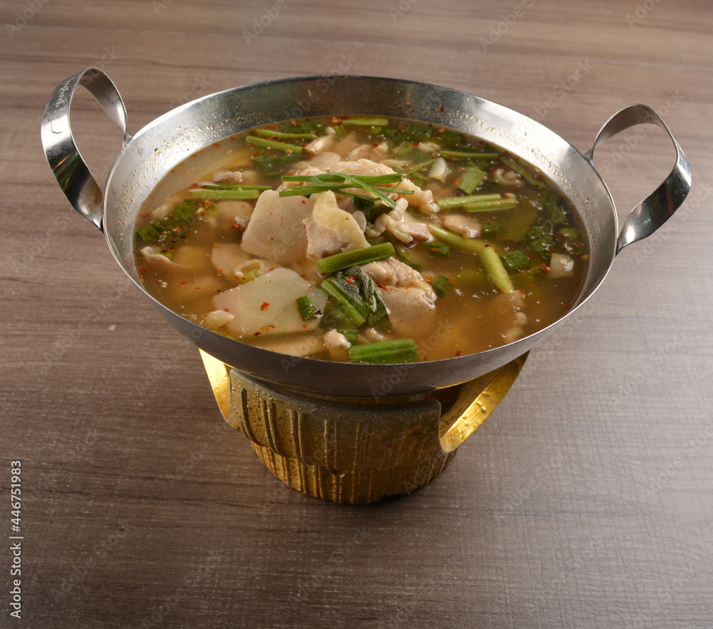 thai clear tom yum spicy chilli hot soup with seafood, meat and ...