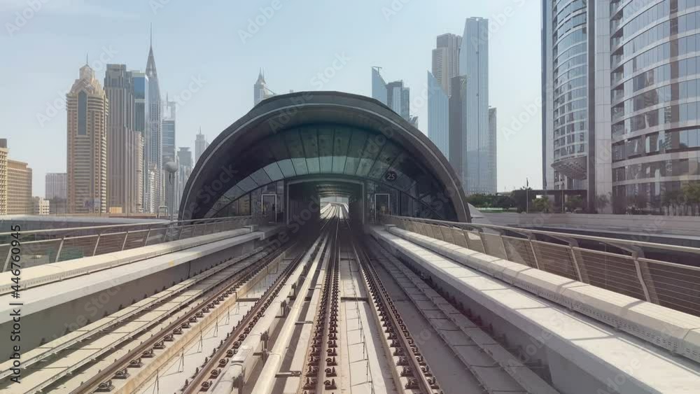DUBAI, UAE - July 2021. The subway train rides among the glass ...