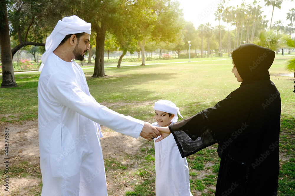 Arab team building. Arabic family having fun together. Playing Emirait ...